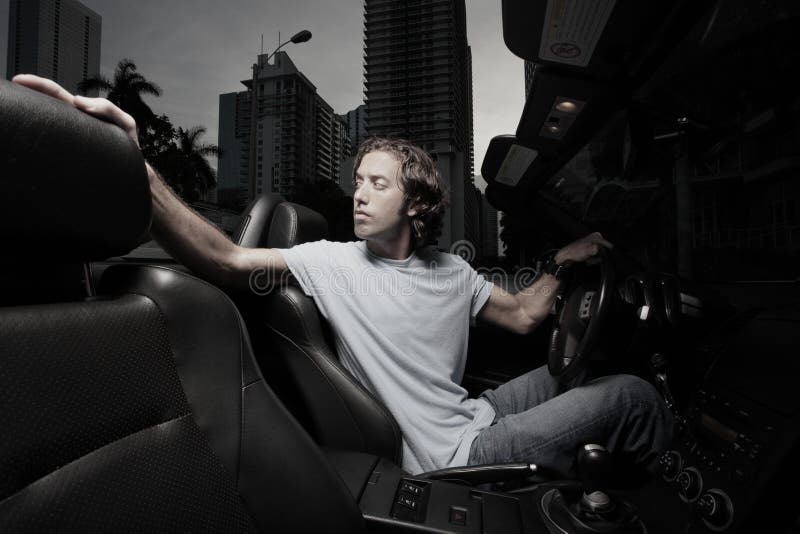 Man in a car backing up stock image. Image of convertible - 10582757