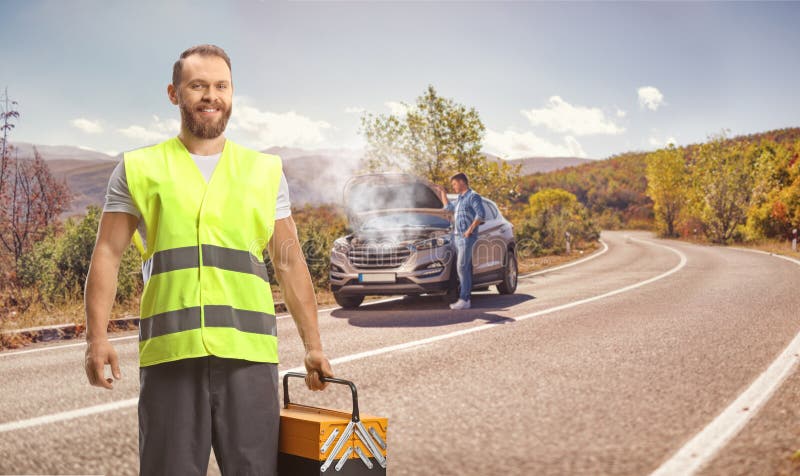 Man with a Car Breakdown on the Road and a Road Help Worker Holding a ...