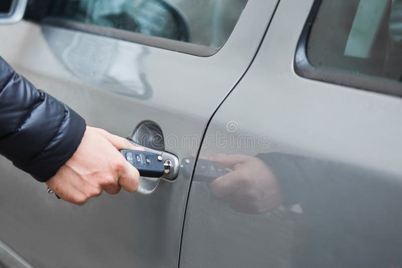 Man with Car Key. Opening Car Door. Stock Photo - Image of sunset, city ...