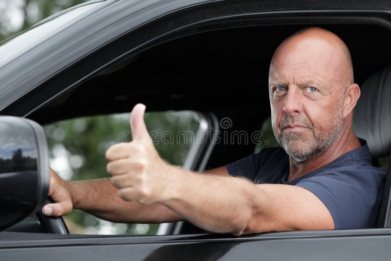 Man in car with thumbs up stock photo. Image of sitting - 261156354