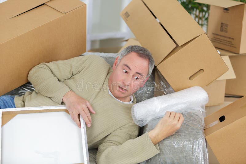 Man in cardboard box stock image. Image of domestic - 123593551
