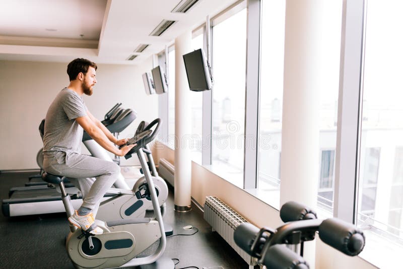 Man Cardio Training on a Bicycle Stock Image - Image of machine ...