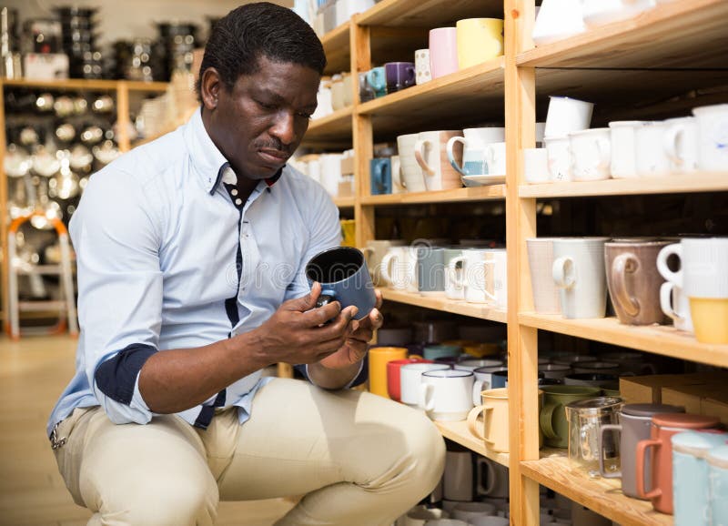 Man Carefully Chooses Ceramic Mugs in Store Stock Image - Image of shop ...