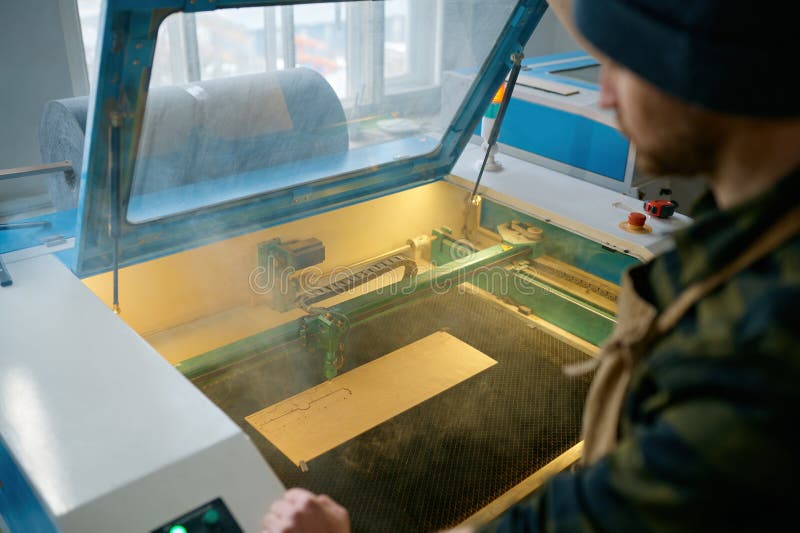 Man Carpenter Operating CNC Laser Machine in Automated Woodworking ...