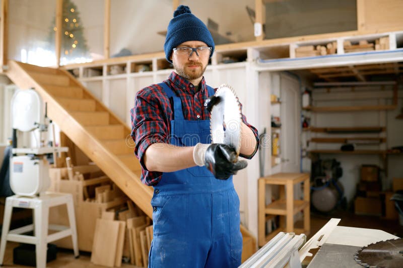 Man Carpenter Preparing Round Saw Blade for Woodworking at Workshop ...