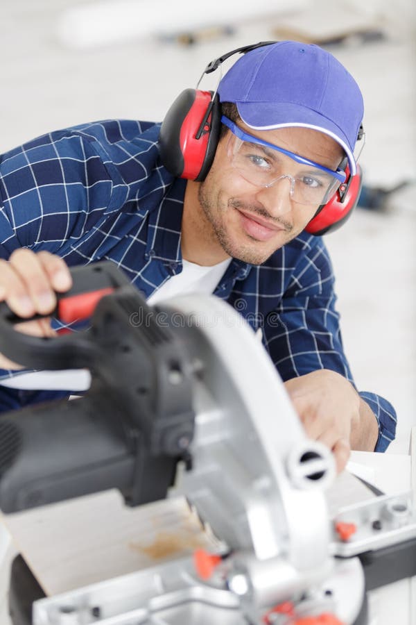 Man carpenter at work stock photo. Image of board, homeinterior - 235482812