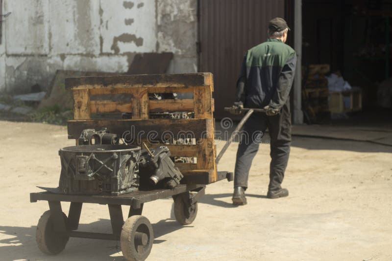 Man Carries Cart. Worker Pulls Load Editorial Stock Photo - Image of ...