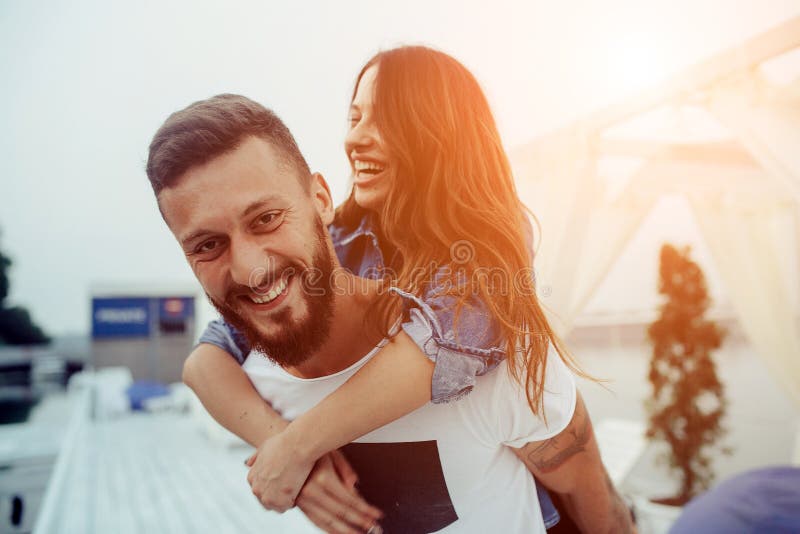 Man Carries Girlfriend on His Back Stock Image - Image of girlfriend ...