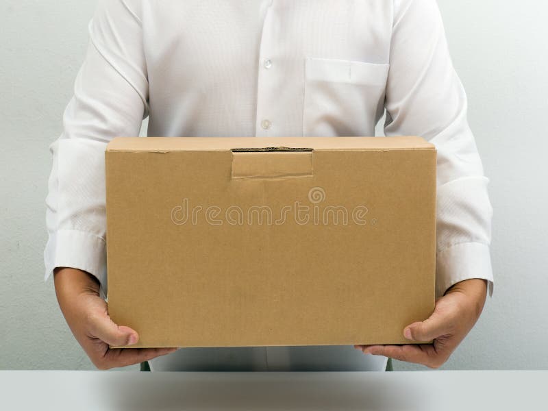 Man carry brown paper box stock photo. Image of concept - 21703144