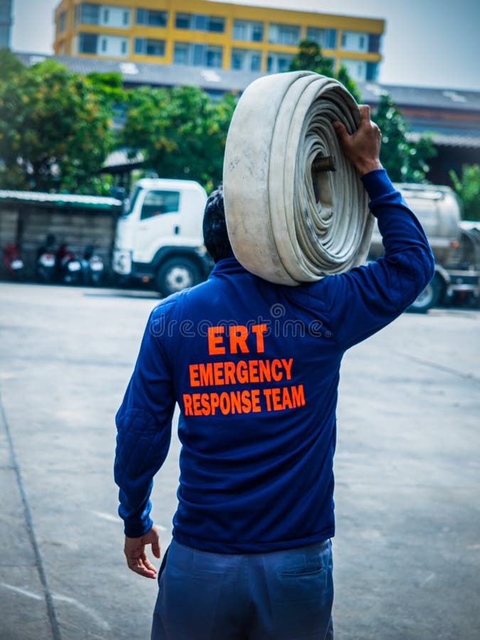 Man Carry Fire-hose on the Shoulder Stock Photo - Image of equipment ...