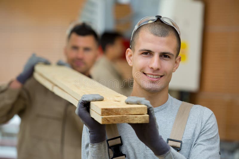 Man carry wood on shoulder stock image. Image of green - 286823325