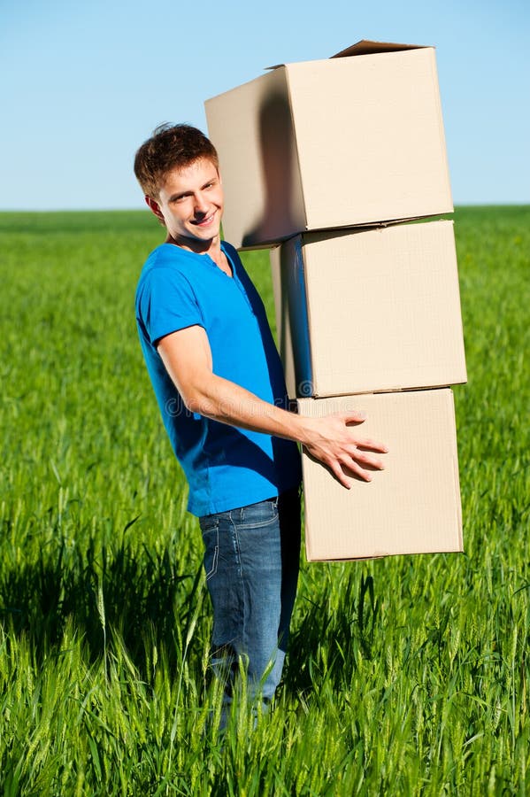 Man carrying boxes stock photo. Image of happy, cardboard - 20576558