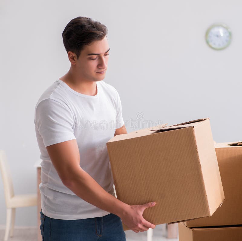 Man carrying boxes at home stock image. Image of boxes - 238964575