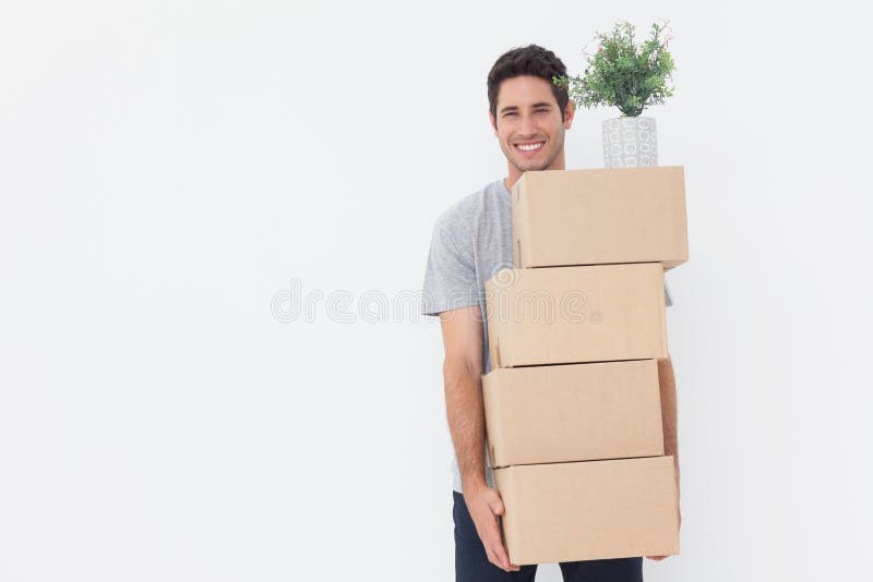 Man Carrying Boxes because he is Moving in a New House Stock Photo ...