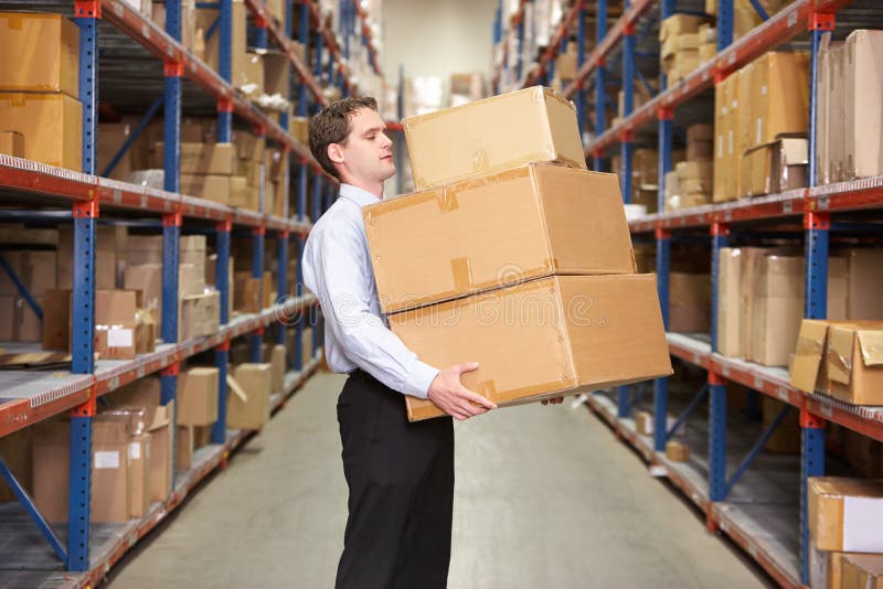 Man Carrying Boxes in Warehouse Stock Photo - Image of management ...