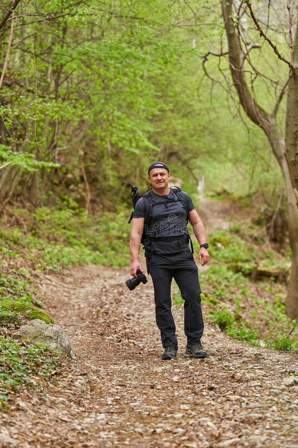 Photographer on Spring Forest Trail Stock Photo - Image of camera ...
