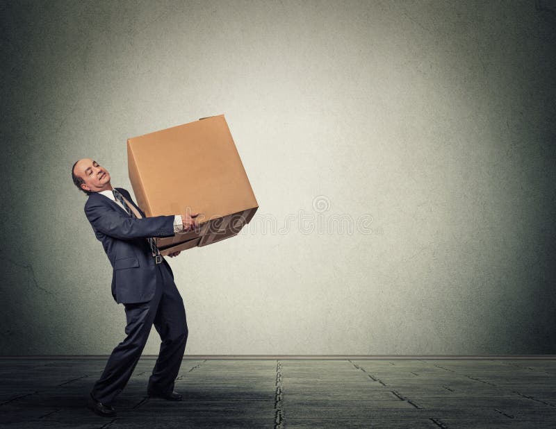 Man carrying heavy box stock image. Image of pile, lift - 69199057