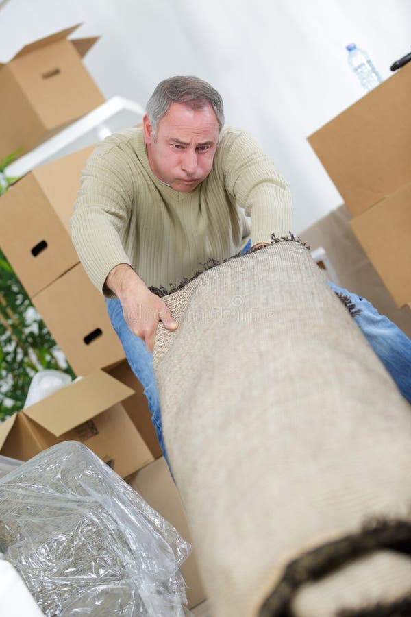 Man Carrying Rolled Carpet Stock Photos - Free & Royalty-Free Stock ...