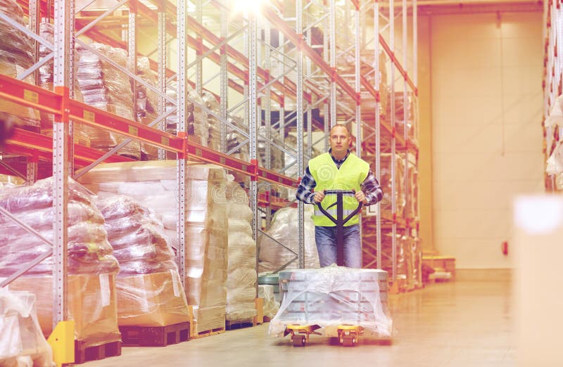 Man Carrying Loader with Goods at Warehouse Stock Image - Image of ...