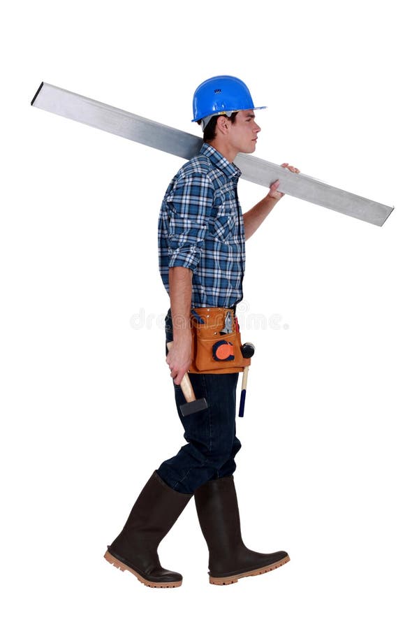 Man carrying metal beam stock image. Image of beam, crain - 33937505