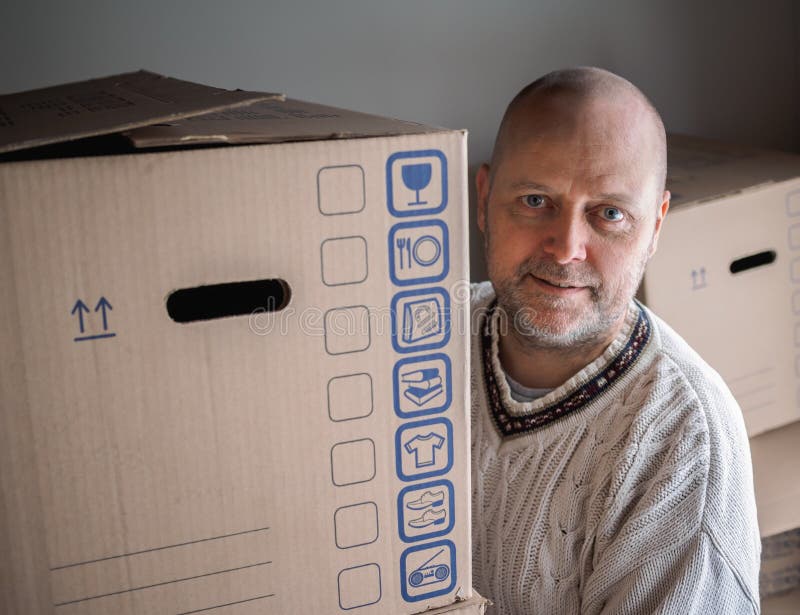 Man carrying moving boxes stock photo. Image of working - 67138316