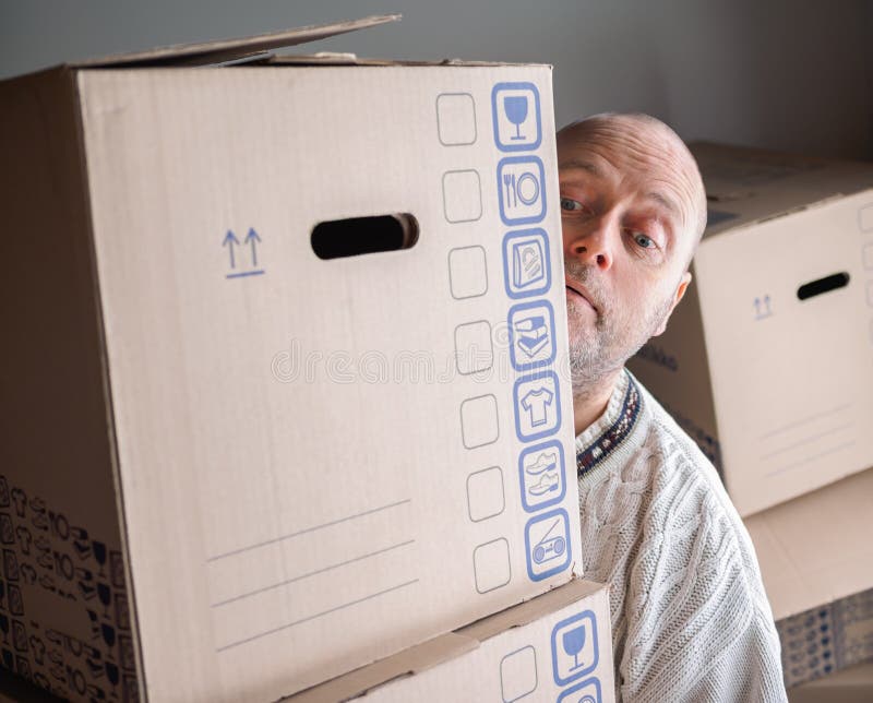 Man carrying moving boxes stock image. Image of caucasian - 67138333