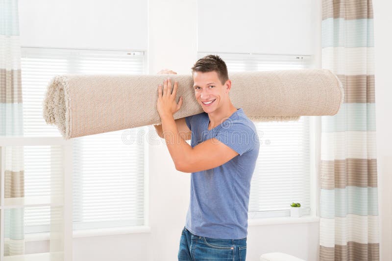 Man Carrying Rolled Carpet Stock Photos - Free & Royalty-Free Stock ...