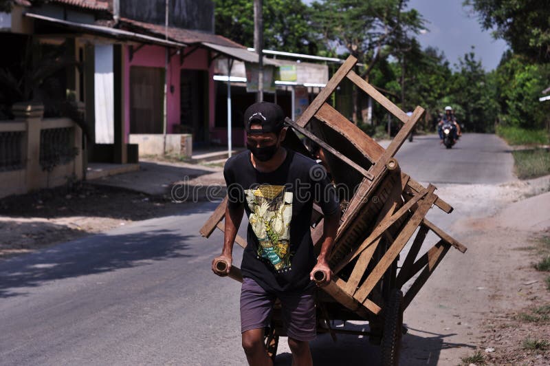 A Man is Carrying Several Benches Editorial Photo - Image of photograph ...