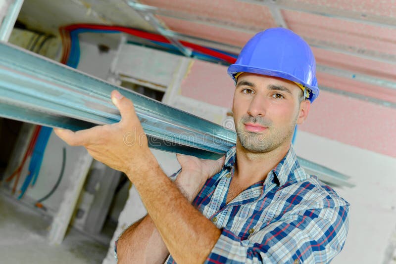 Man carrying steel frame stock image. Image of skill - 244998541