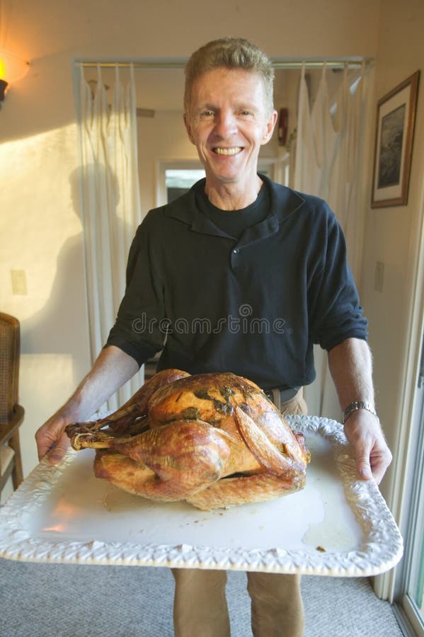 Man Carrying in Thanksgiving Turkey for Dinner Editorial Photo - Image ...