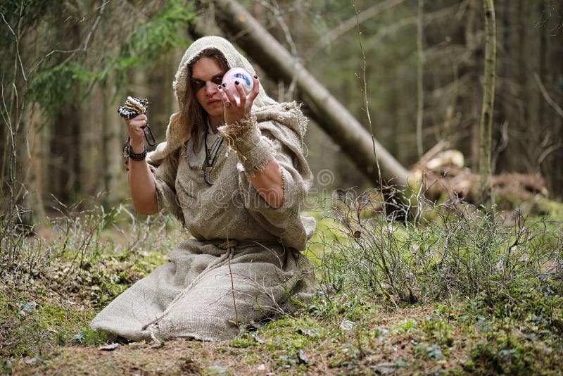 A Man in a Cassock Spends a Ritual in a Dark Forest Stock Photo - Image ...