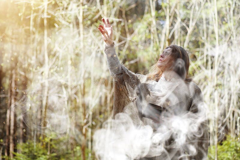 A Man in a Cassock Spends a Ritual in a Dark Forest Stock Photo - Image ...