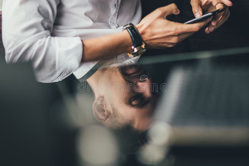 Man in Casual Form Using Mobile Phone at the Cafe. Reflection Stock ...