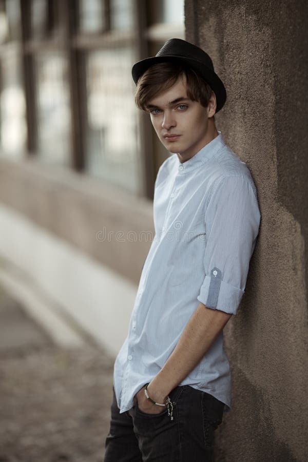 Man Casually Leaning Against the Wall Stock Image - Image of style ...