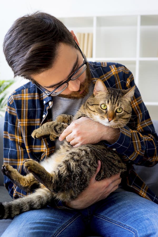 Man with a cat stock image. Image of mother, love, care - 99302725