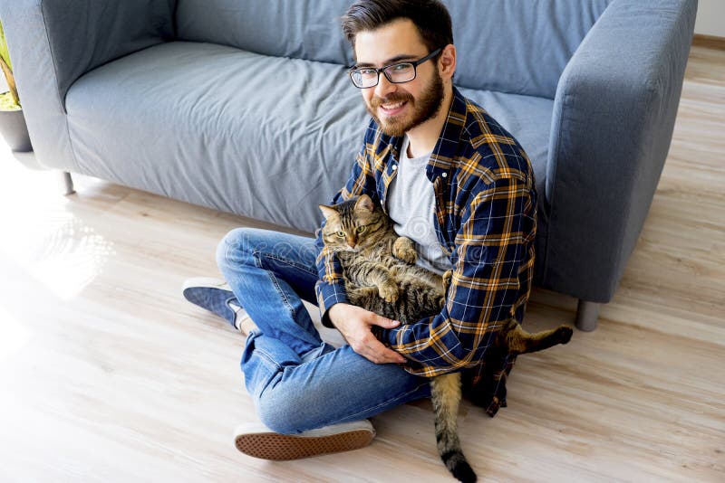 Man with a cat stock image. Image of young, parent, life - 99303373