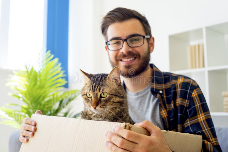 Man with a cat stock image. Image of feelings, adult - 99305783