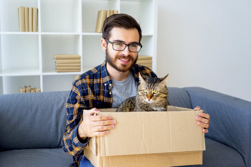 Man with a cat stock photo. Image of feelings, love, indoor - 99305968