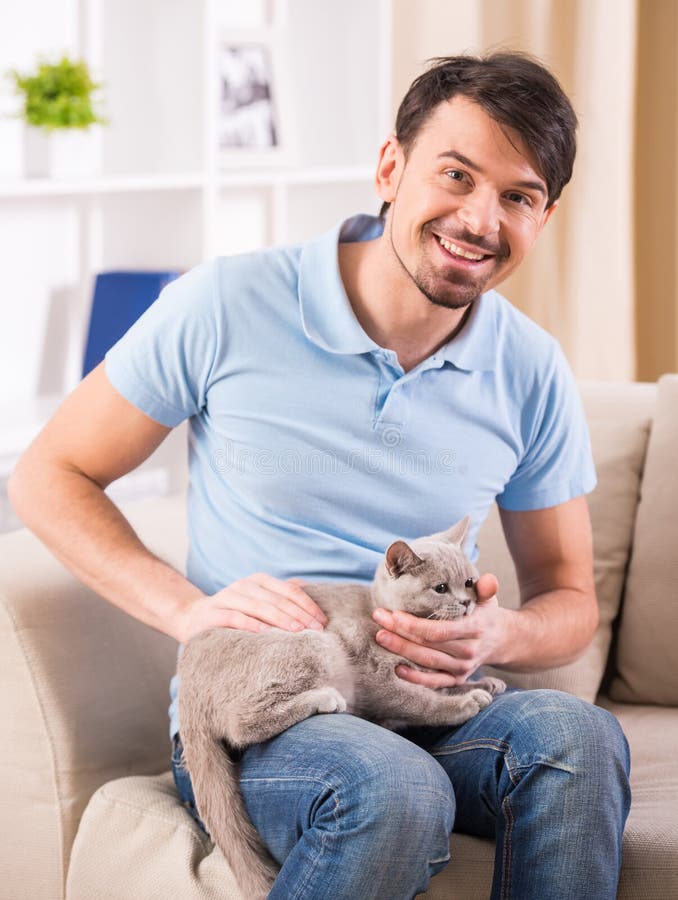 Man with cat stock image. Image of mature, home, beauty - 49688477