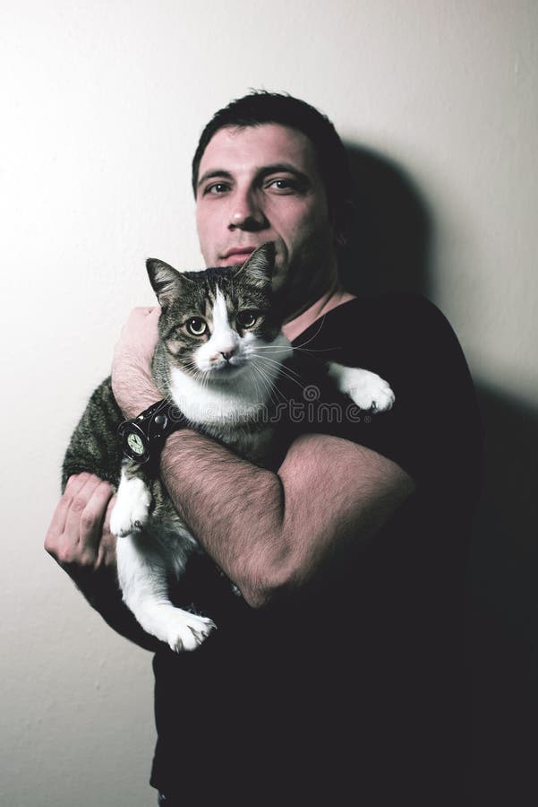 Man with a cat stock image. Image of tabby, owner, lifestyle - 64773965