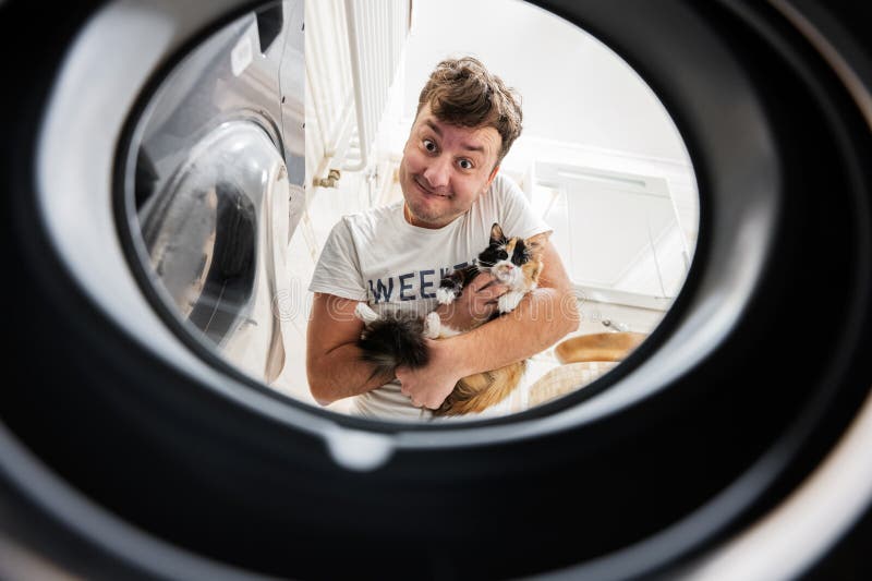 Man with Cat View from Washing Machine Inside. Male Does Laundry daily ...