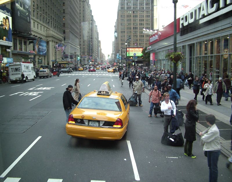 Man Catches a Cab in Downtown New York City Editorial Stock Image ...