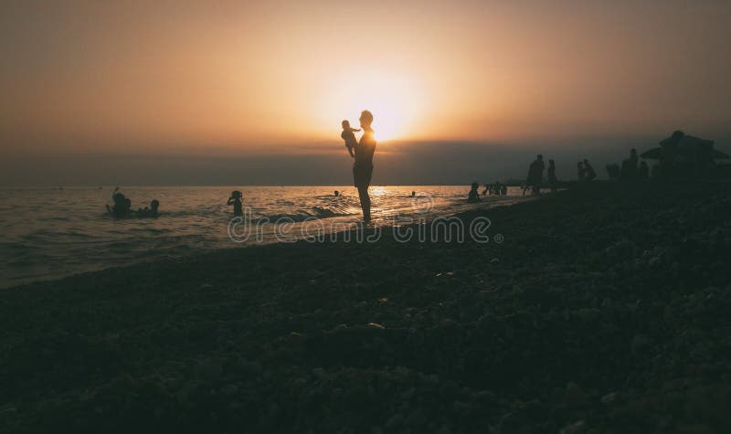 Man Catching His Son on the Beach Stock Photo - Image of happiness ...