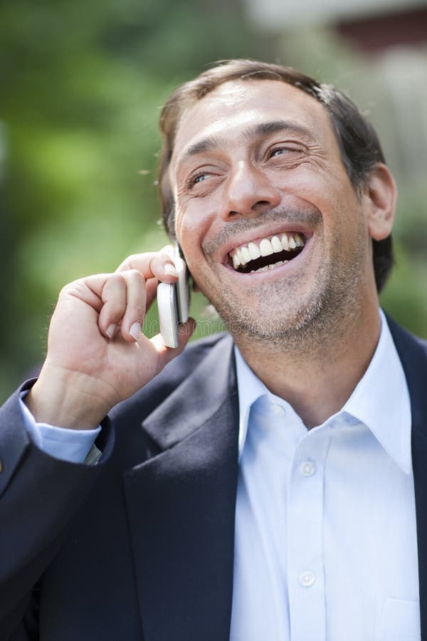 Man on cell phone stock photo. Image of chatting, coat - 8195358