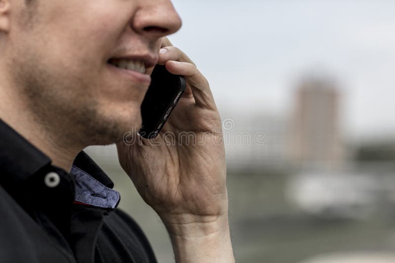 Man on Cell Phone Lower Face Stock Image - Image of hand, conversation ...
