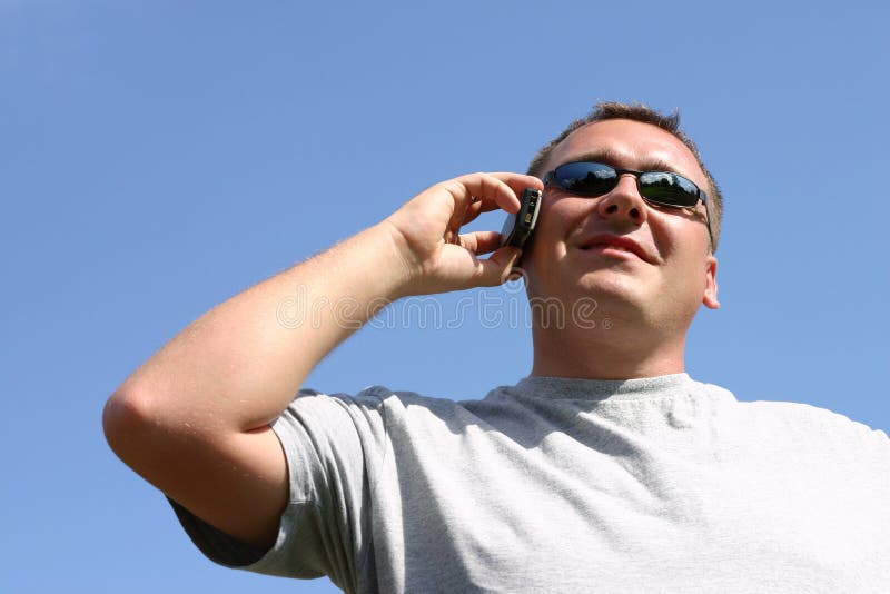 Smiling man with cellphone stock image. Image of cellular - 15425