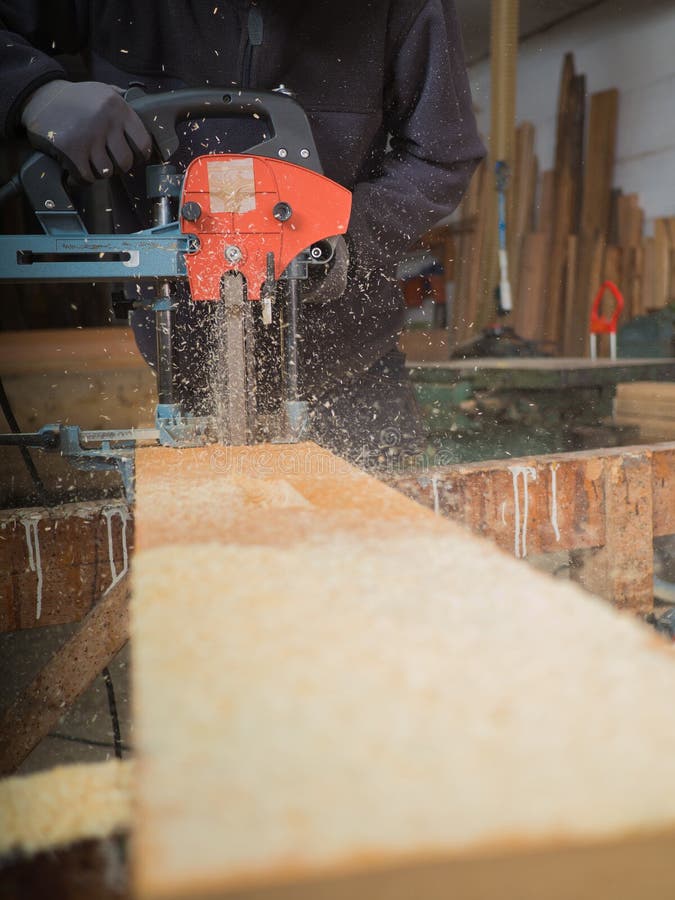 Man with Chain Mortiser Mill-cuts a Wooden Board Stock Image - Image of ...
