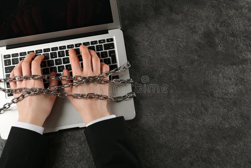 Man Chained To Laptop at Grey Table, Top View and Space for Text ...