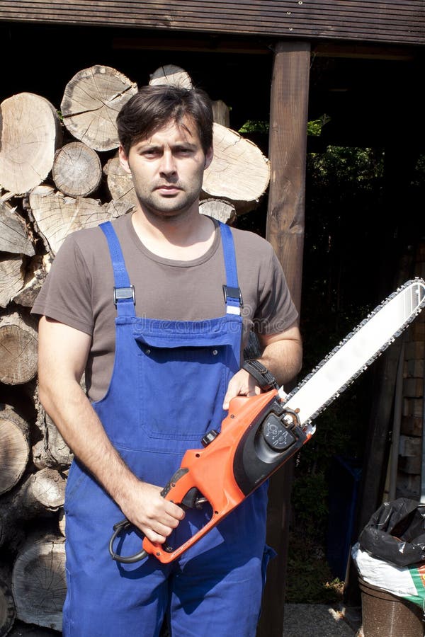 Man with chainsaw stock photo. Image of chainsaw, blue - 25398886