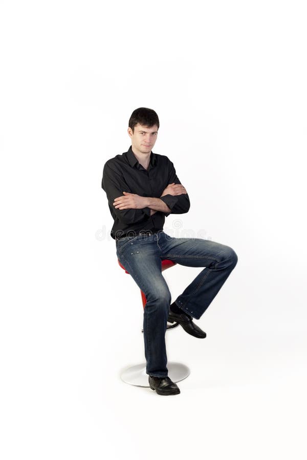 Man on a chair stock image. Image of legs, hair, human - 12487129